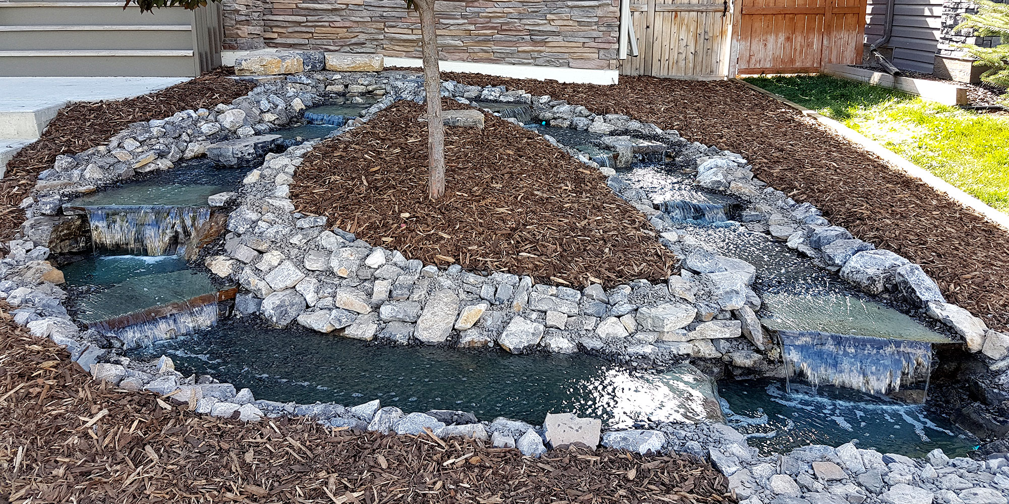 Ponds and Waterfalls - Living Earth Landscapes - Calgary Landscaping